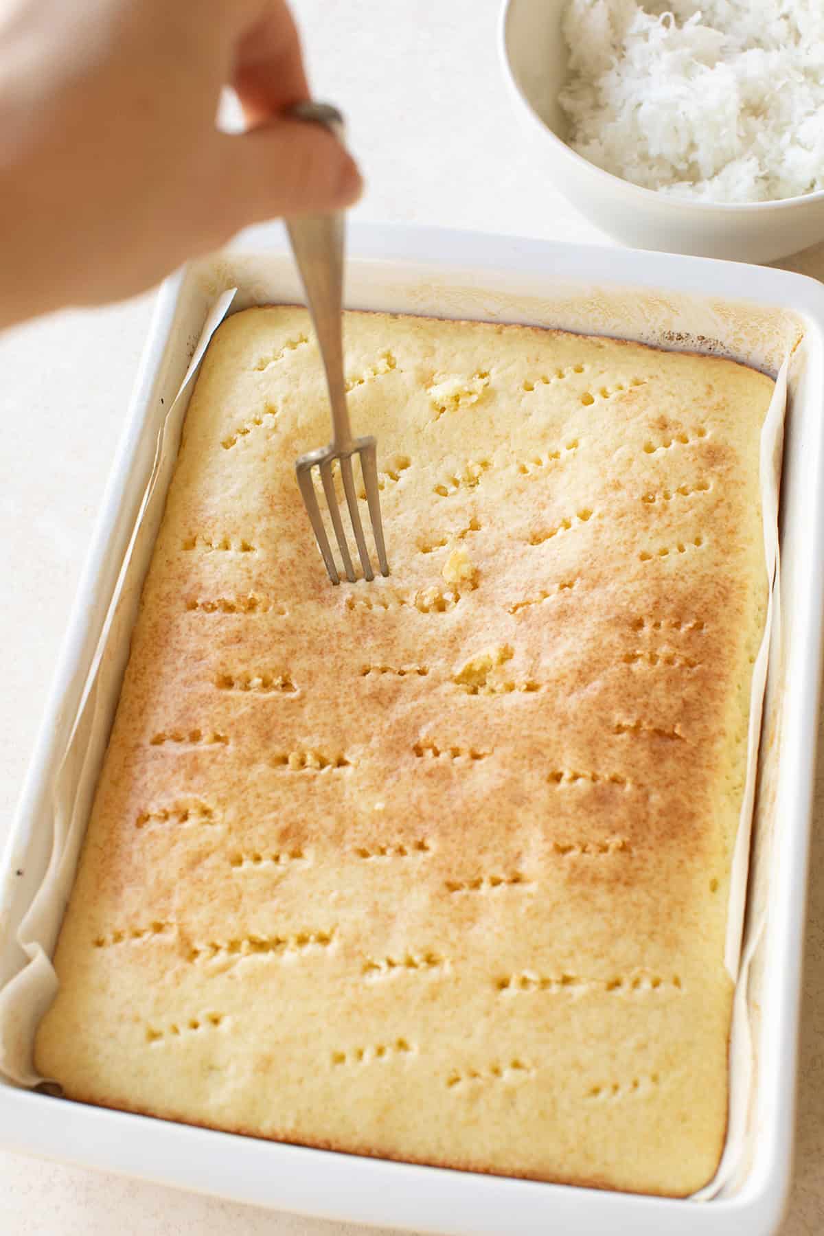 Coconut Poke Cake - Sugar and Charm